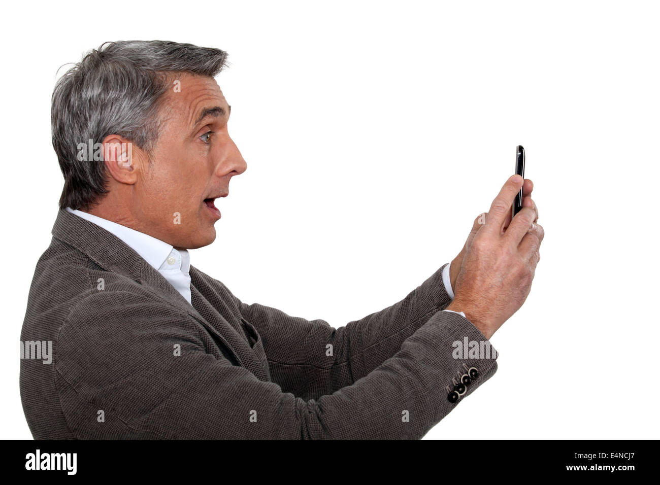 Man caught looking at sms Stock Photo - Alamy