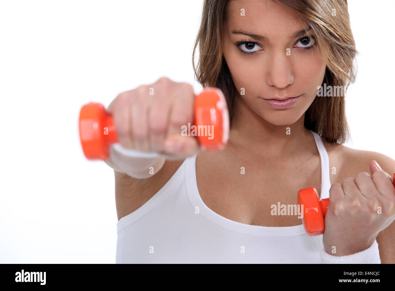 Woman using weights Stock Photo - Alamy