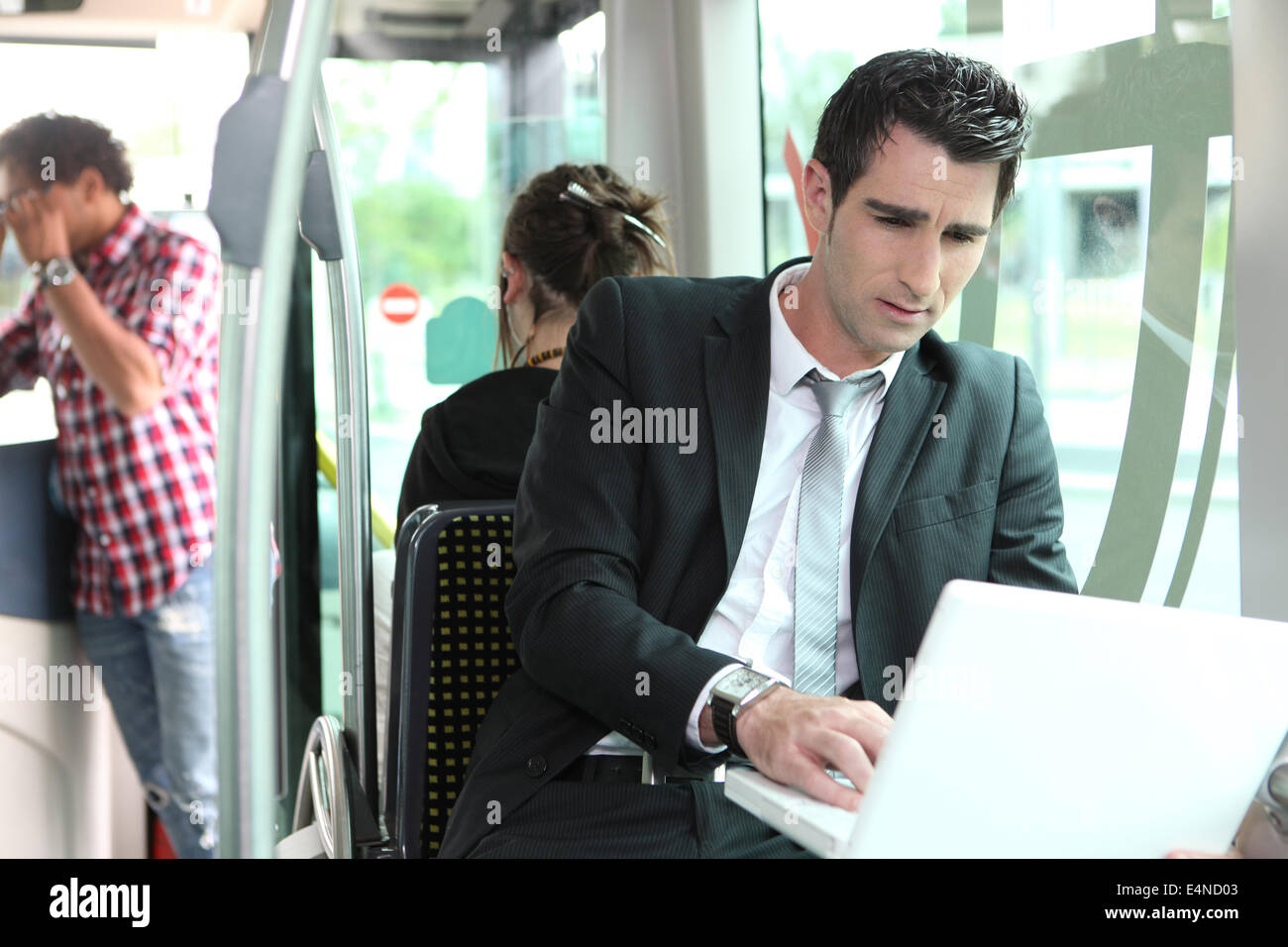 young man in public transportation Stock Photo - Alamy
