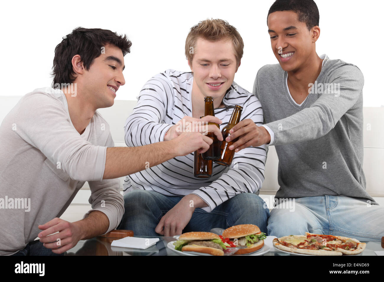 Young men chilling out at home Stock Photo - Alamy