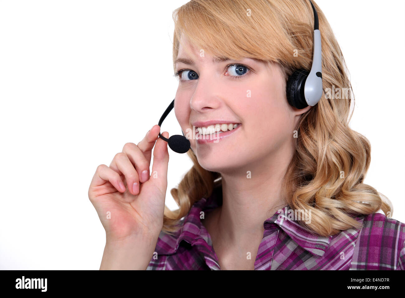 Woman speaking into a headset Stock Photo - Alamy