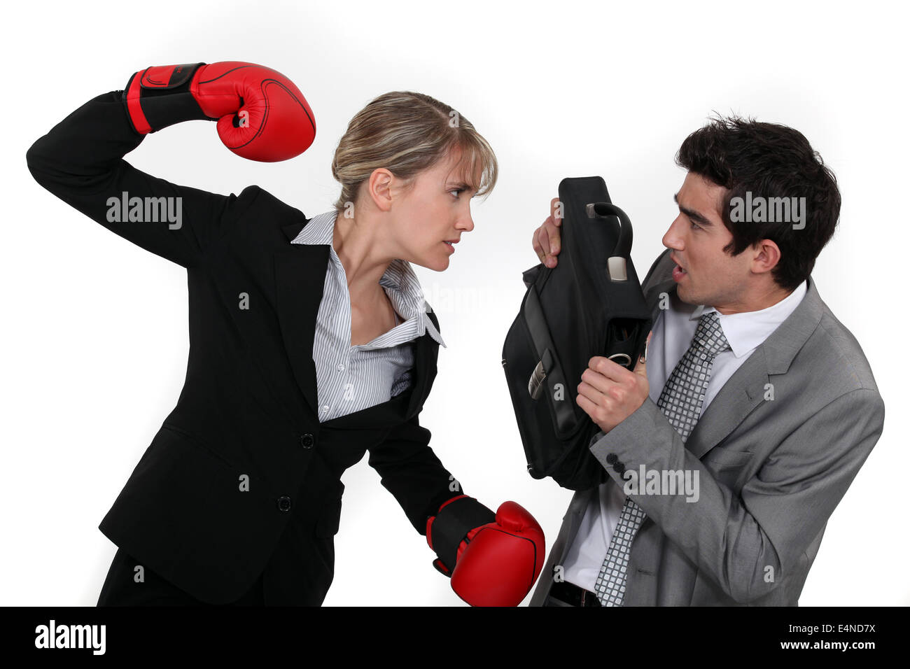 Businesswoman and businessman fighting Stock Photo - Alamy