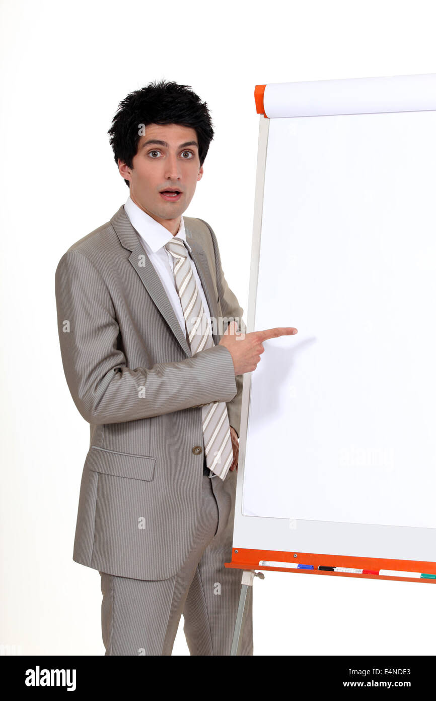 businessman pointing at a white board Stock Photo - Alamy