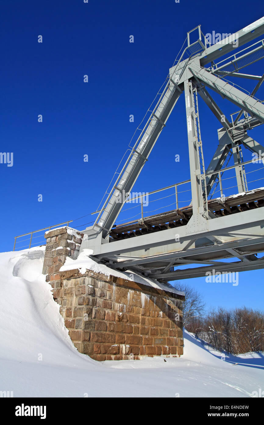 railway bridge through small river Stock Photo - Alamy