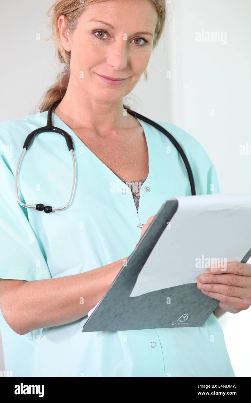 nurse holding file Stock Photo - Alamy