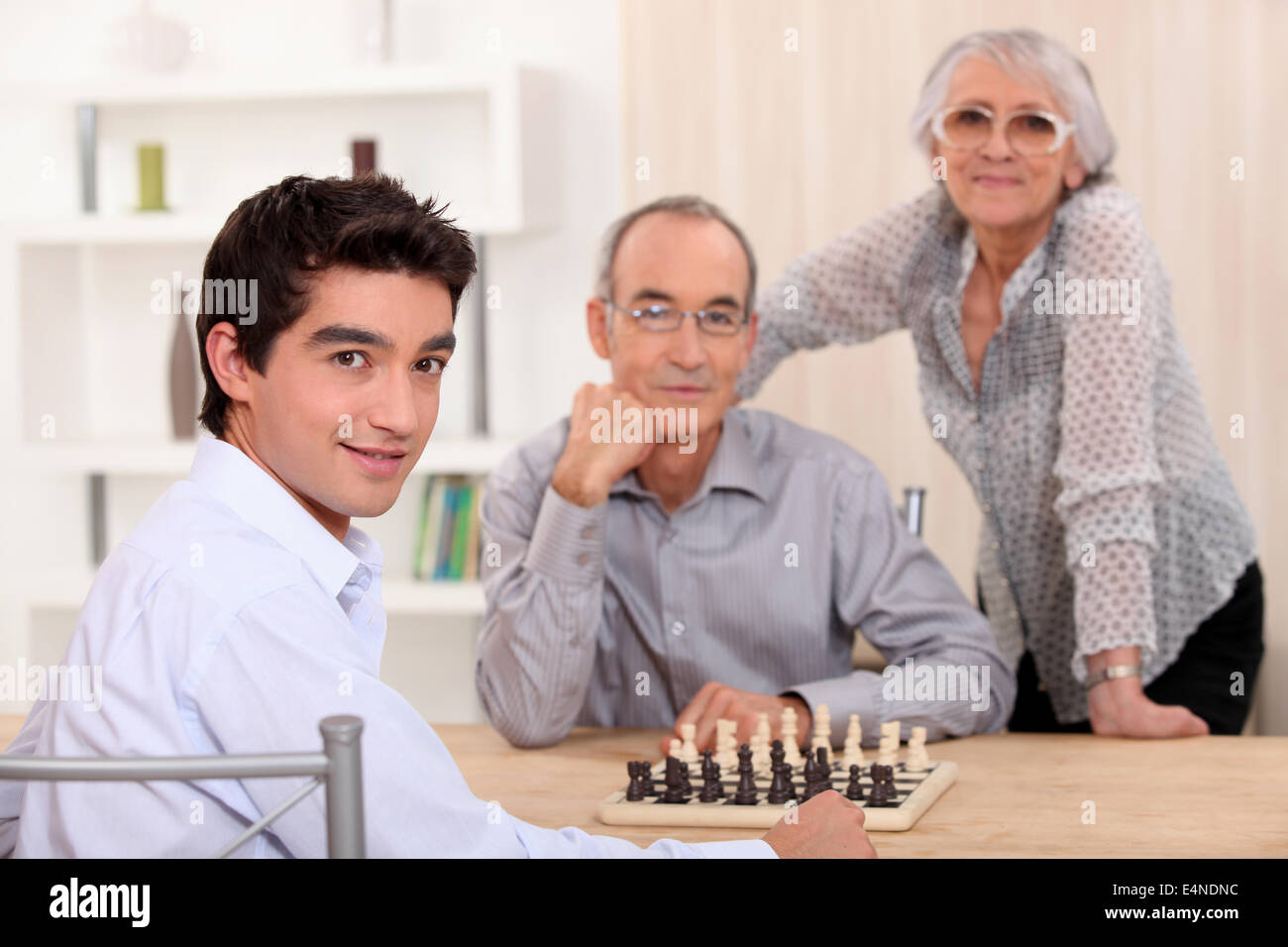 Family playing chess together Stock Photo - Alamy