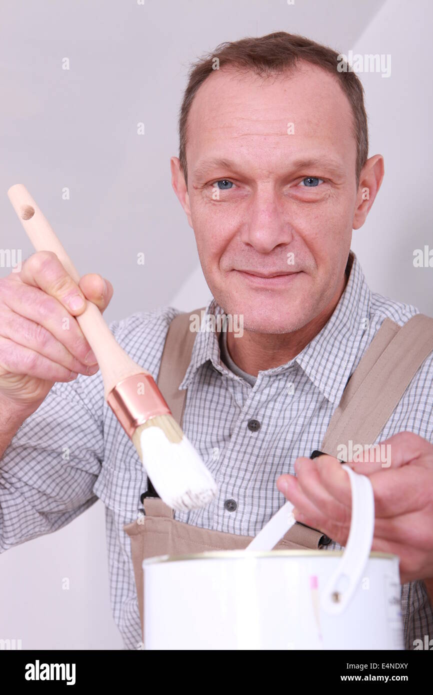 Man preparing to paint a house Stock Photo - Alamy
