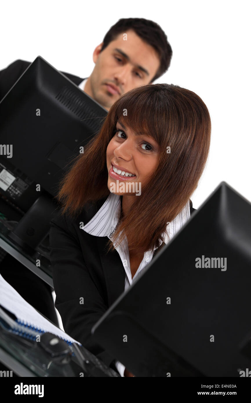 Woman peeking out from behind her computer Stock Photo - Alamy