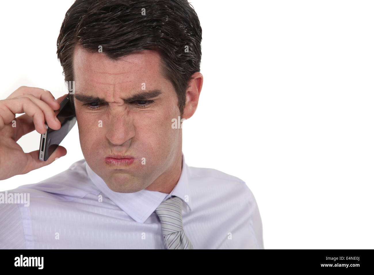 An angry businessman over the phone Stock Photo - Alamy