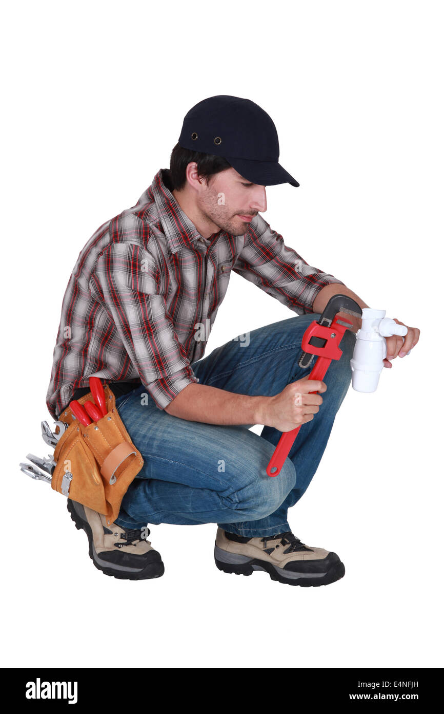 Plumber using spanner hi-res stock photography and images - Alamy