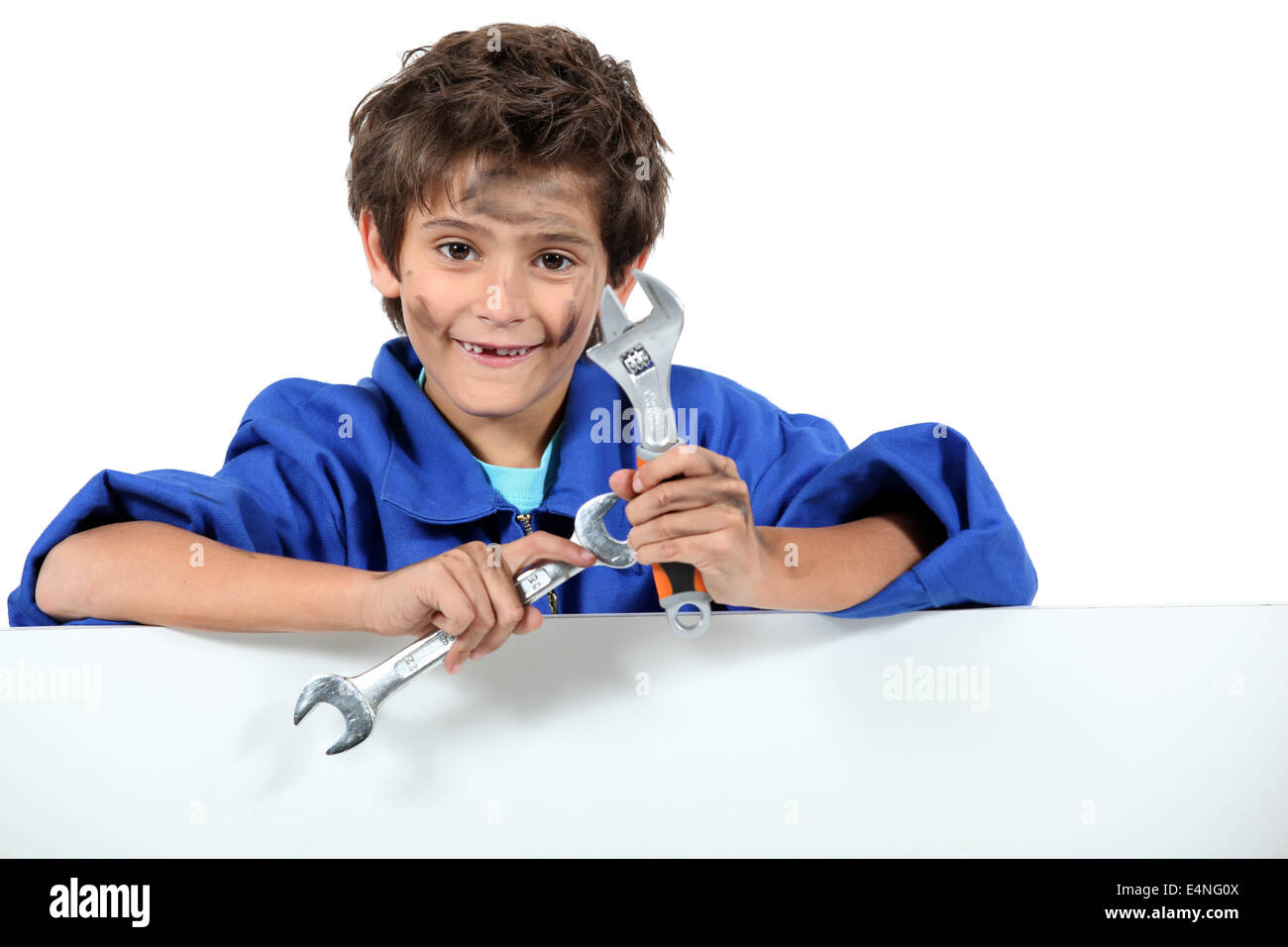 Little boy with mechanic clothing and tools Stock Photo - Alamy