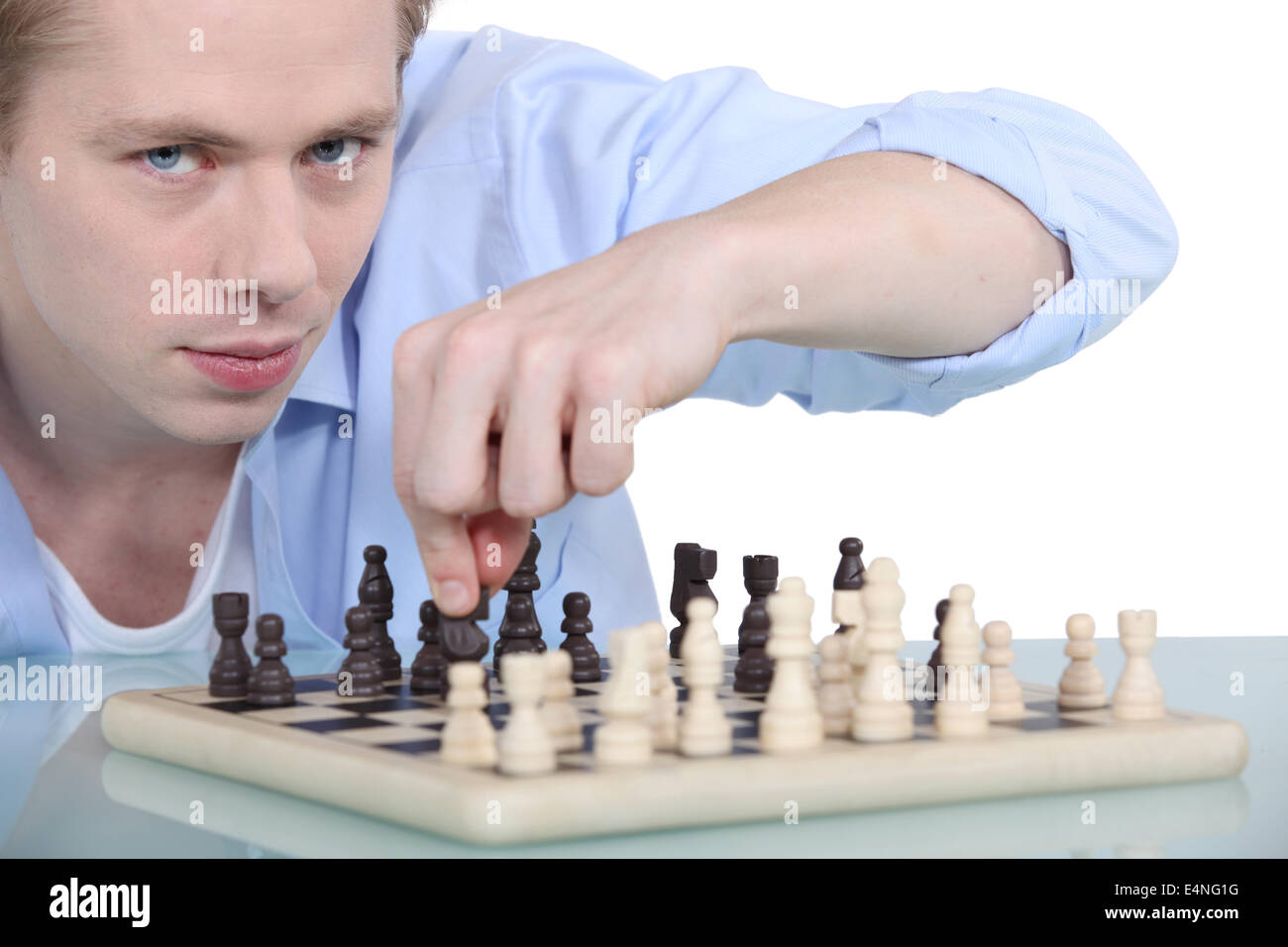 young man playing chess Stock Photo - Alamy
