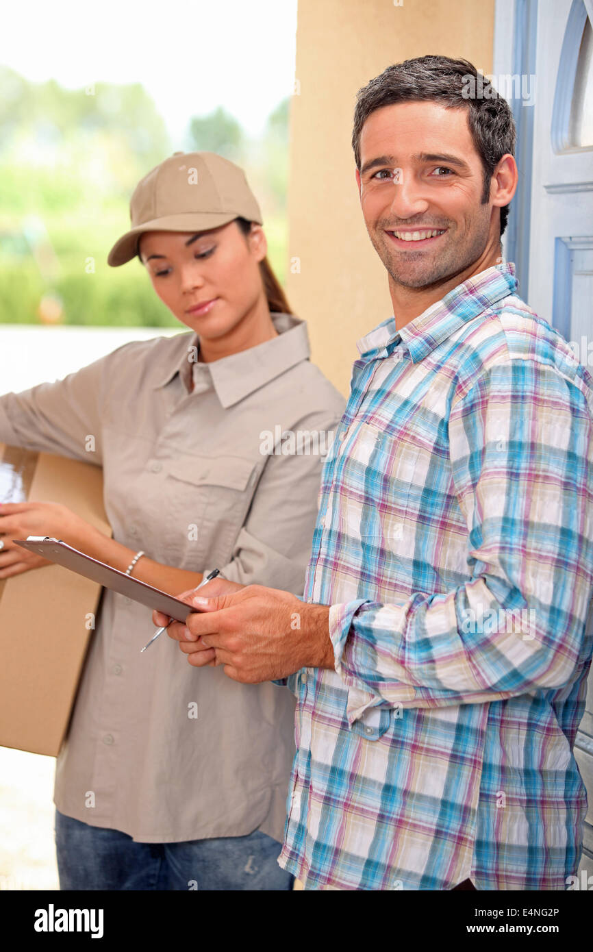 Man collecting package at home Stock Photo - Alamy