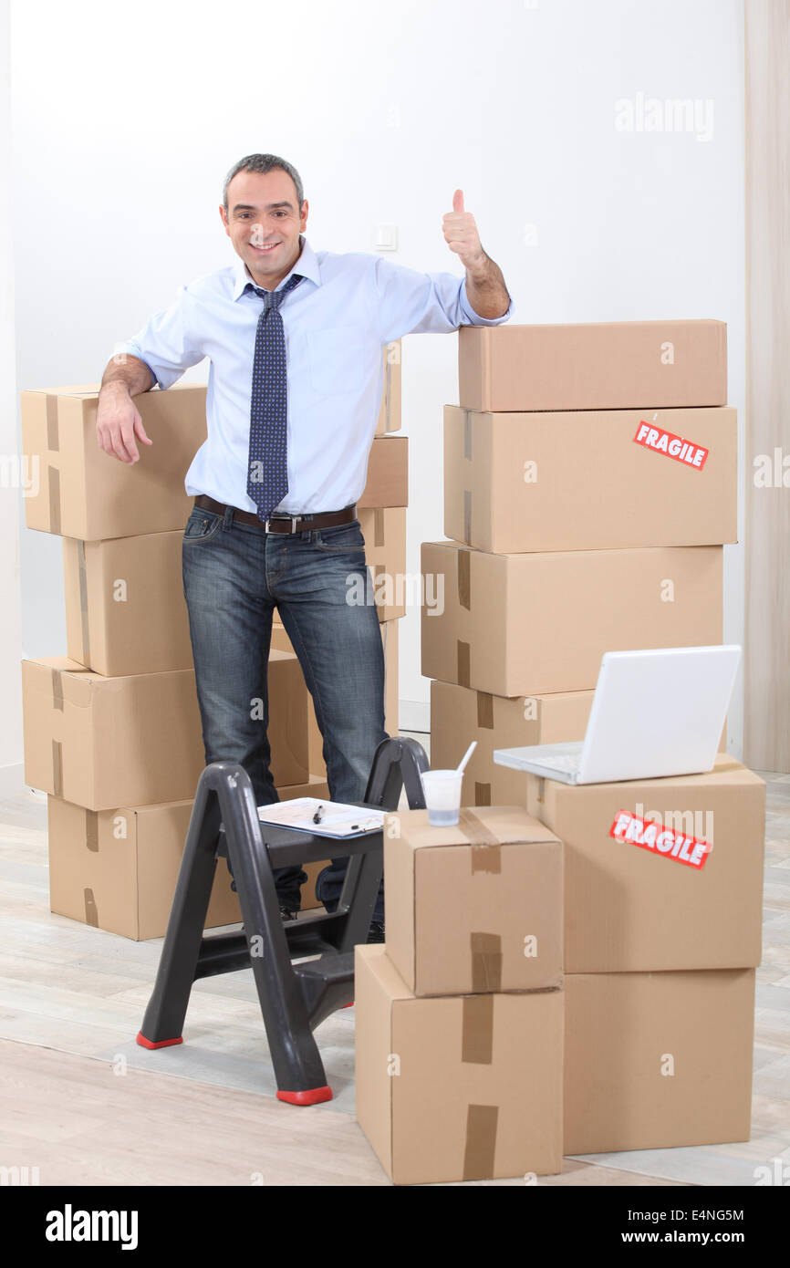 Man surrounded by cardboards Stock Photo - Alamy
