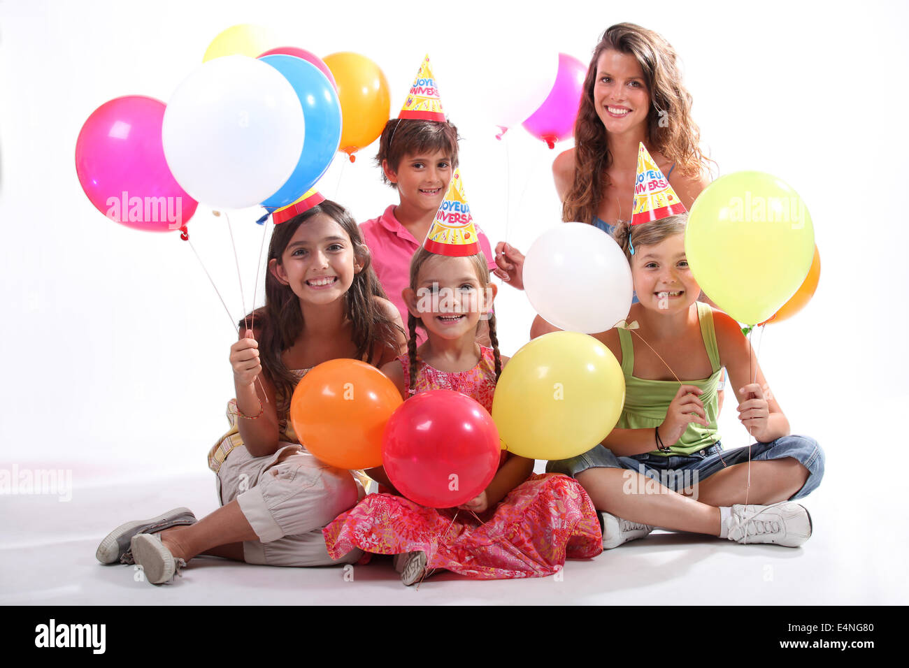 Happy children group of kids with balloons birthday party hi-res stock ...