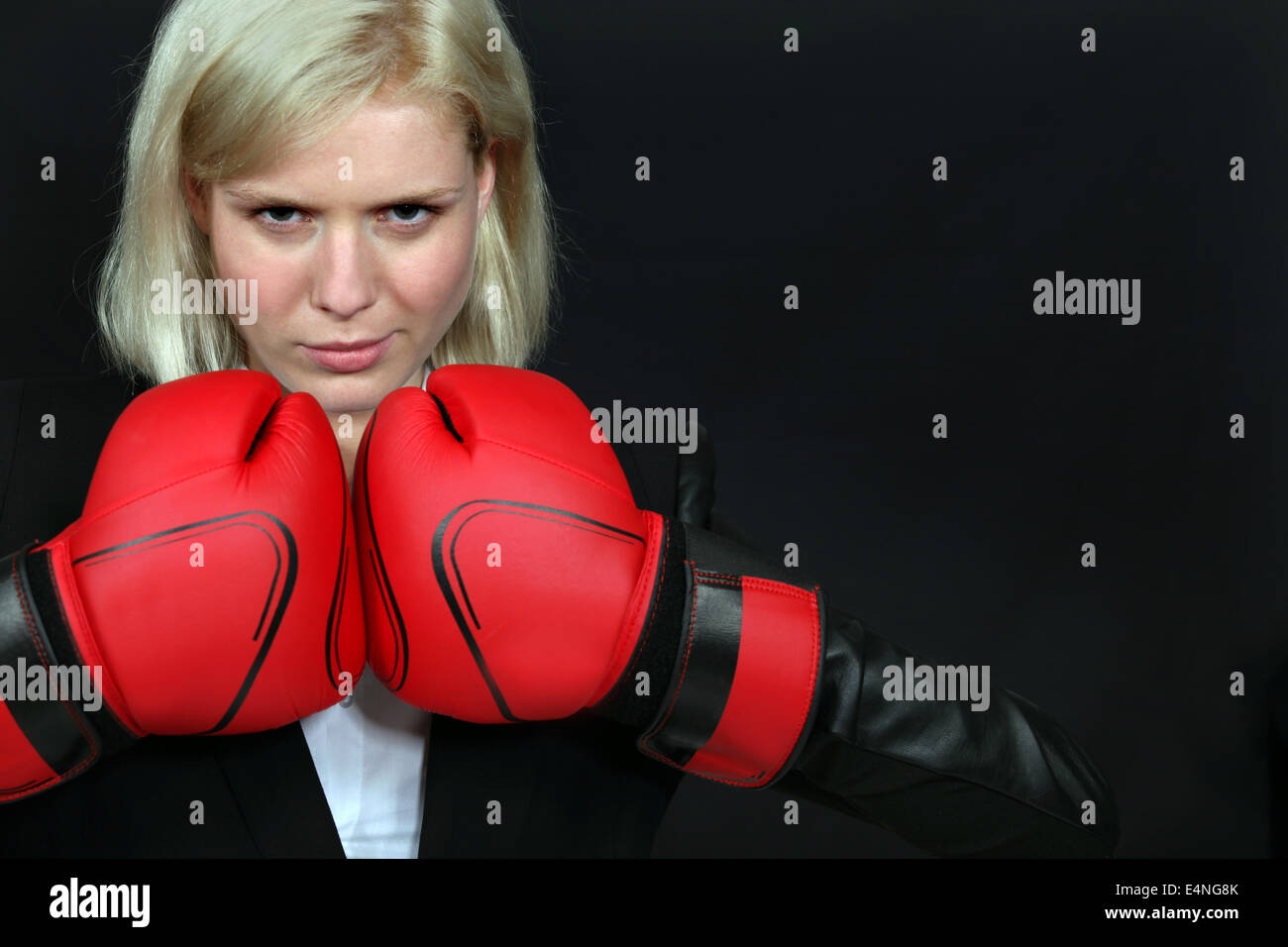 Businesswoman wearing boxing gloves Stock Photo - Alamy