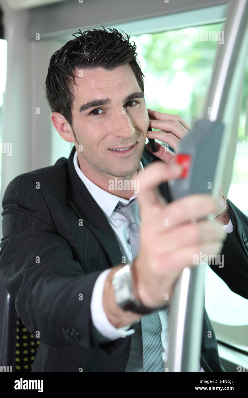 young man in public transportation Stock Photo - Alamy