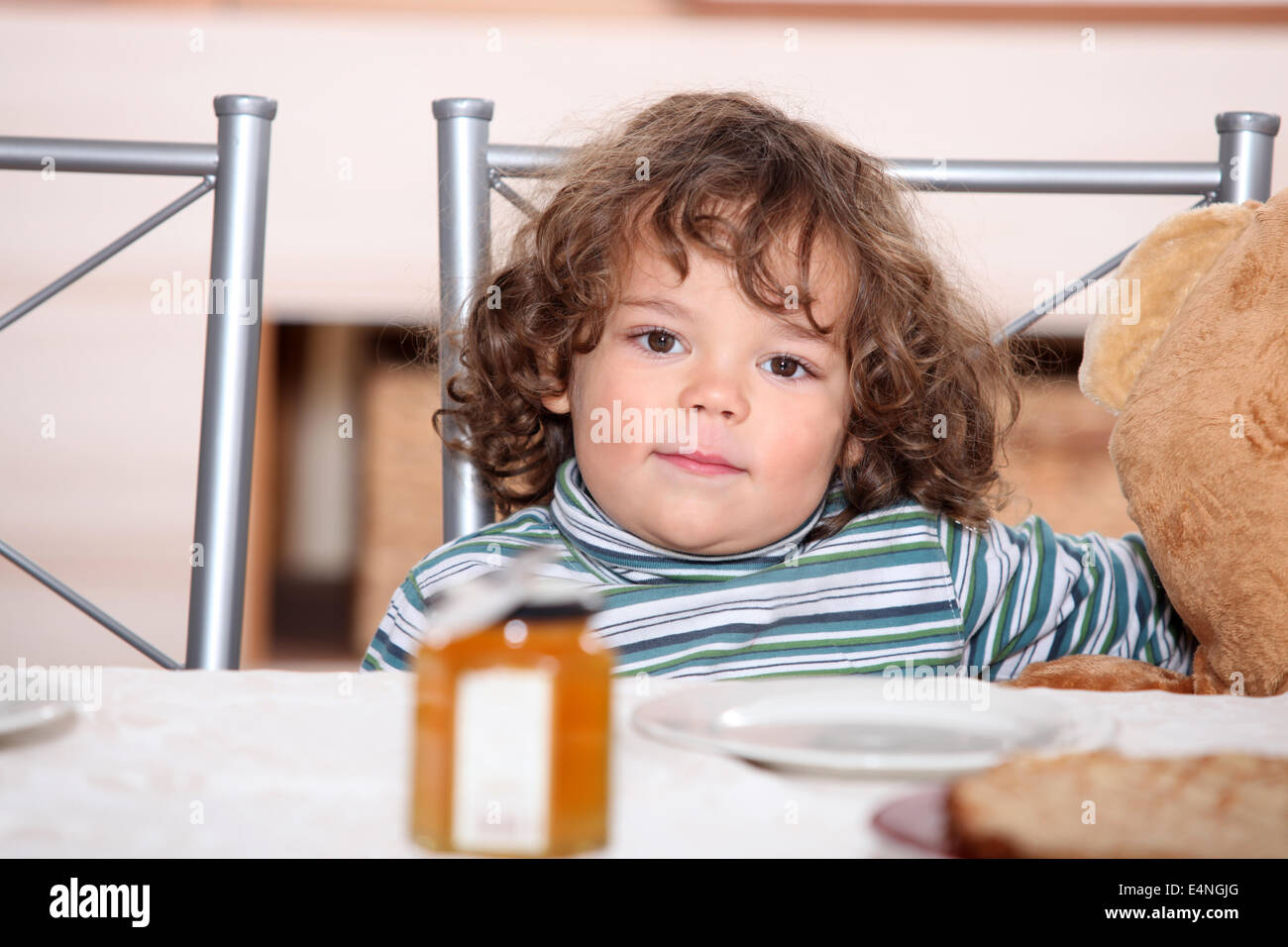 Young child waiting to eat breakfast Stock Photo - Alamy