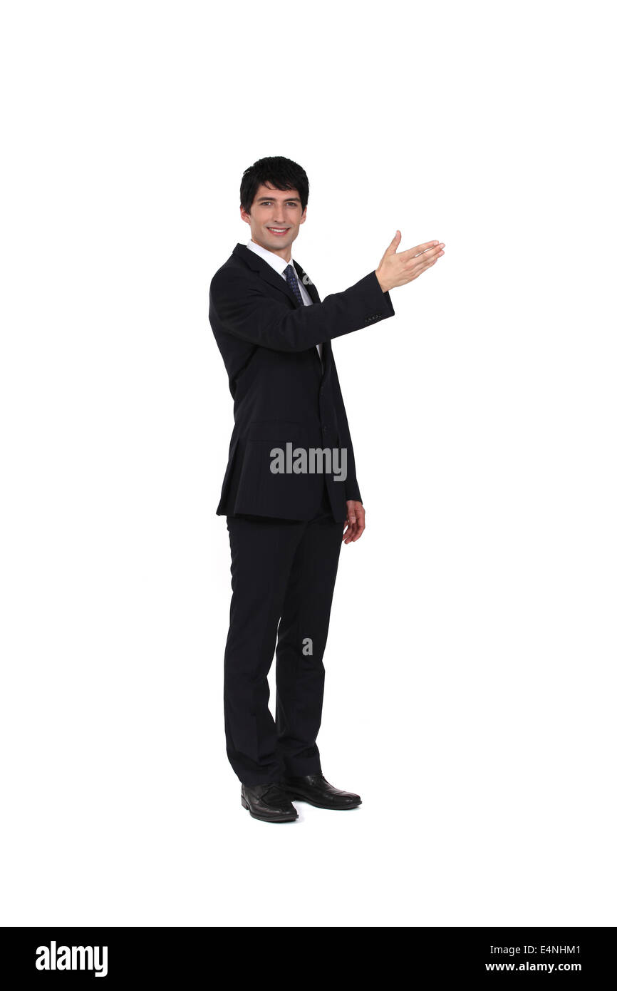 A businessman showing directions Stock Photo - Alamy