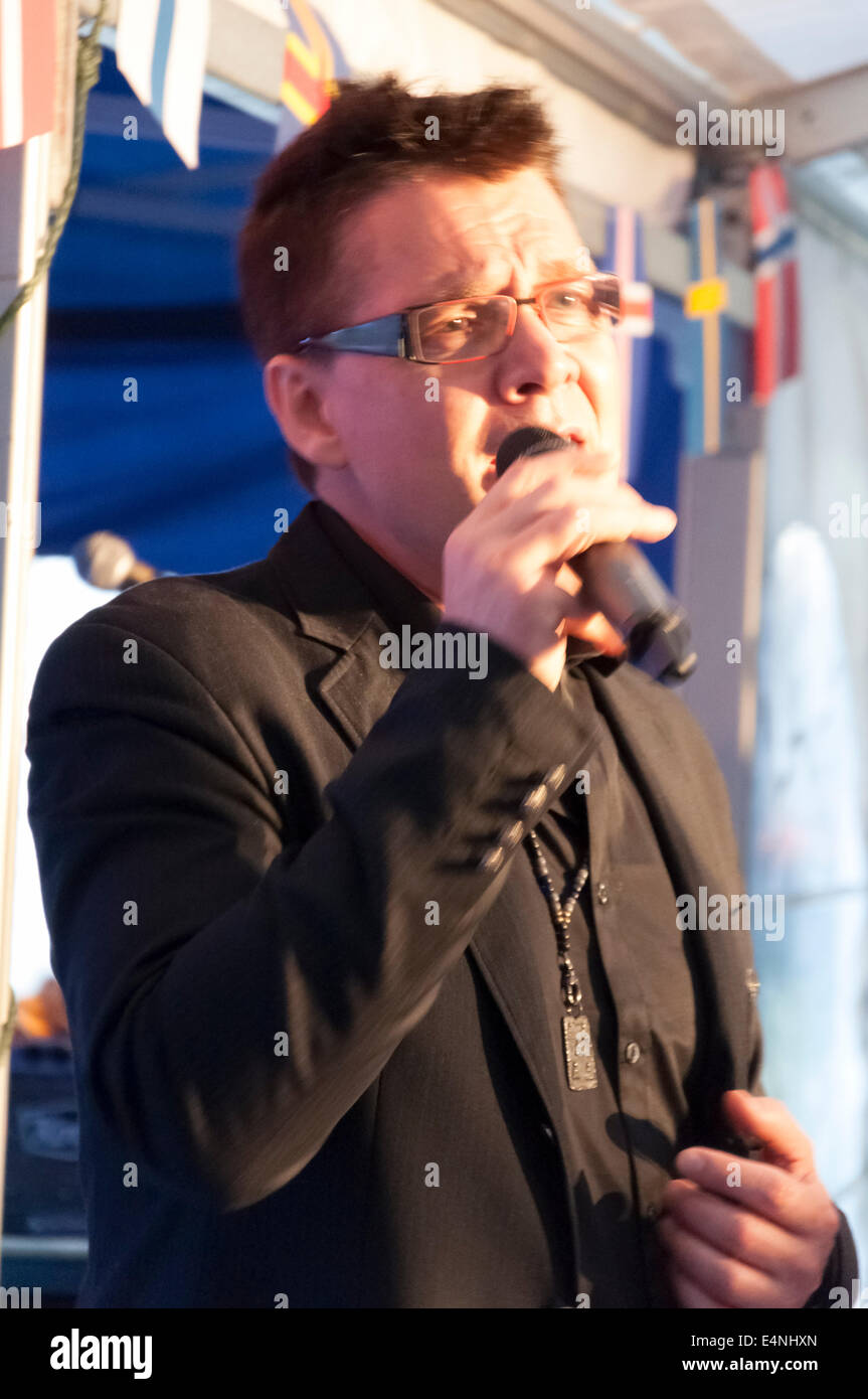 Front man from a band singing at a concert Stock Photo - Alamy