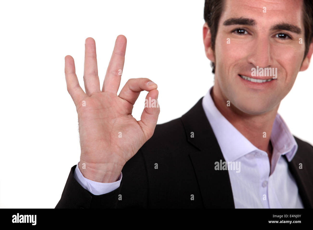 Man giving the a-ok hand gesture Stock Photo - Alamy