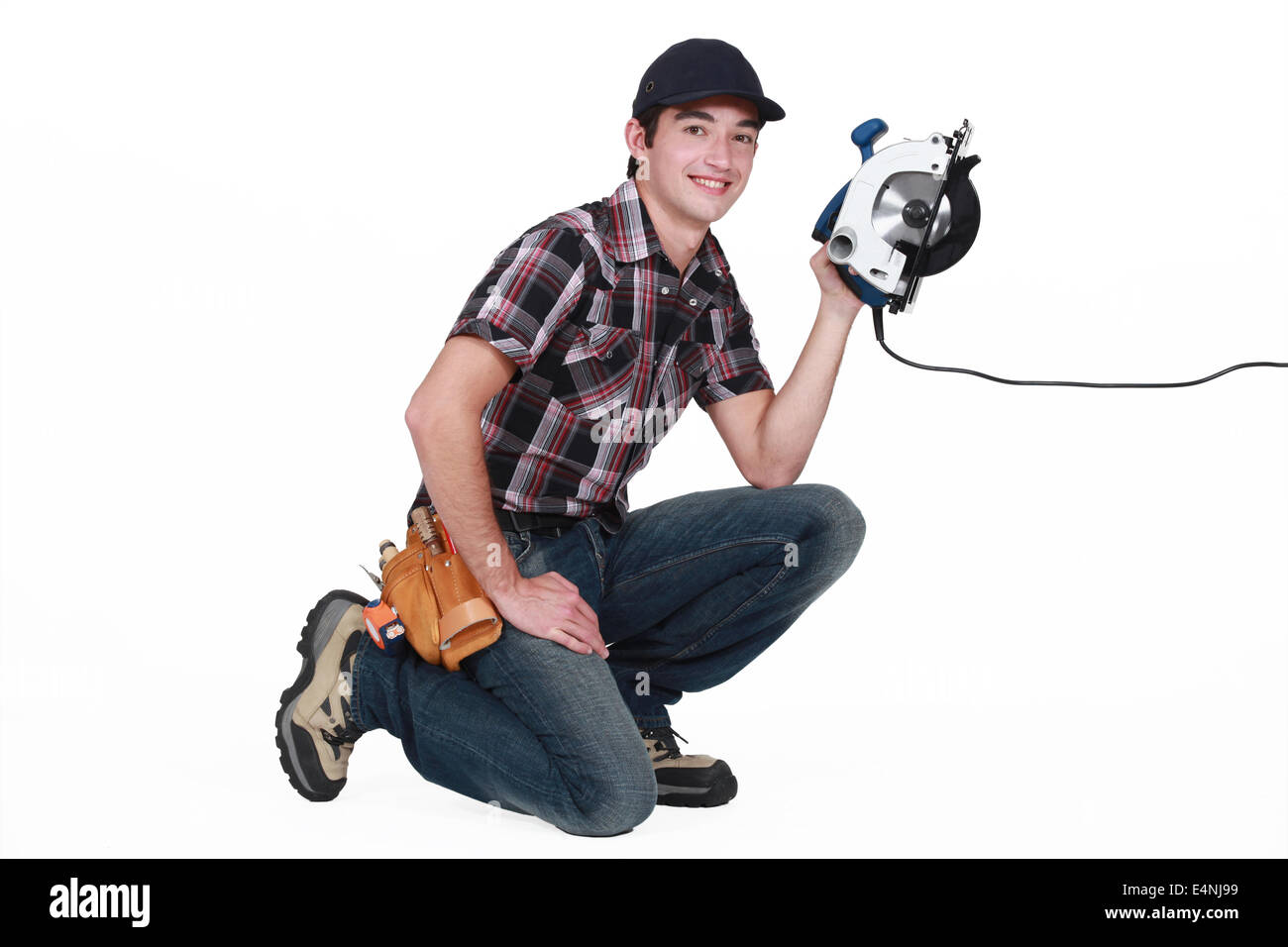 Craftsman holding electric cutter hi-res stock photography and images ...