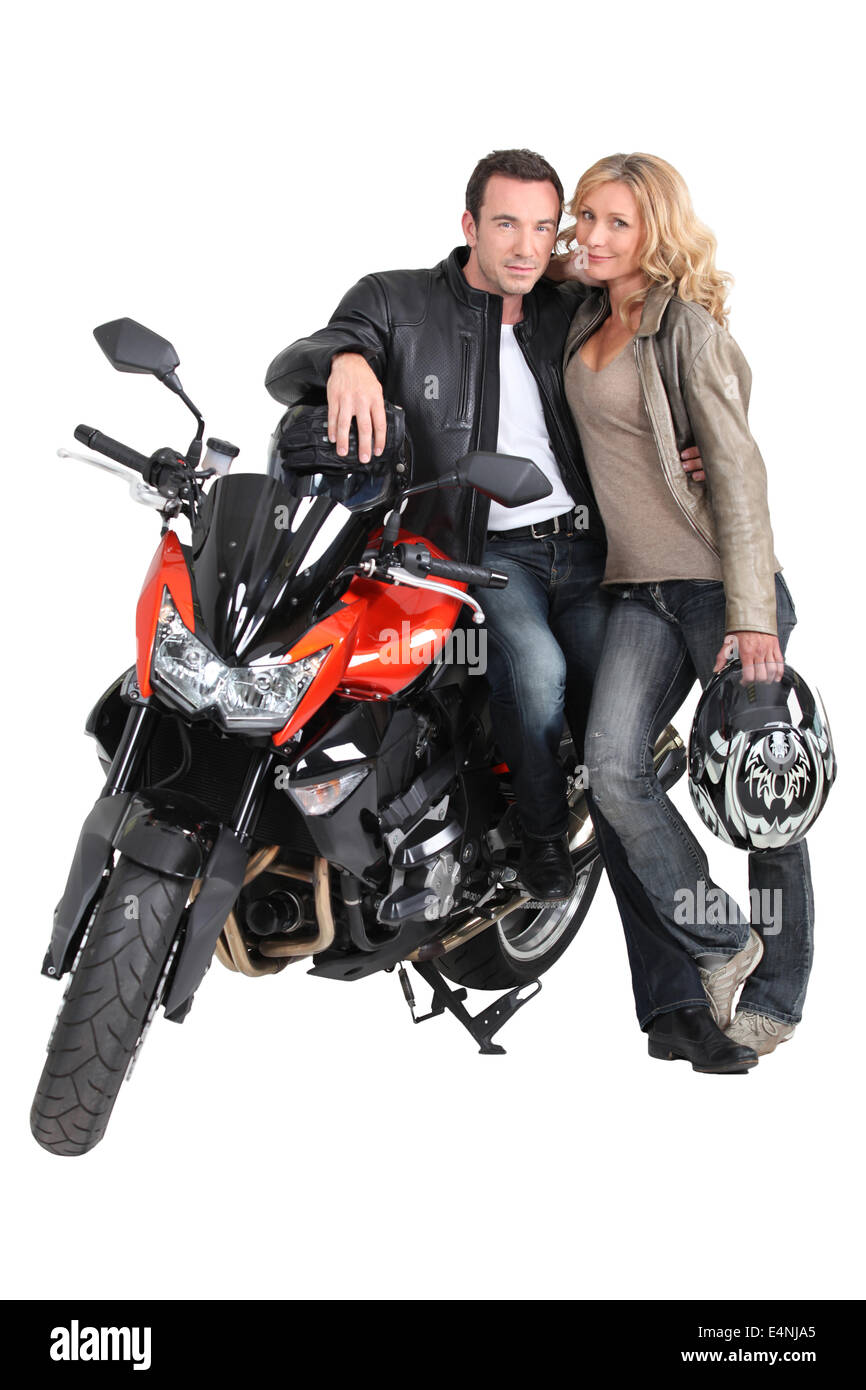 Biker couple and bike Stock Photo - Alamy