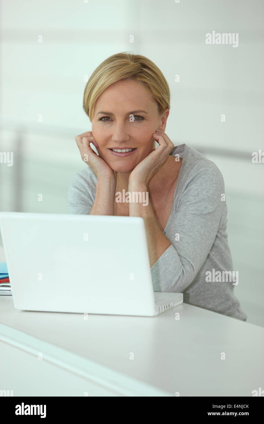 Woman in front of her laptop Stock Photo - Alamy