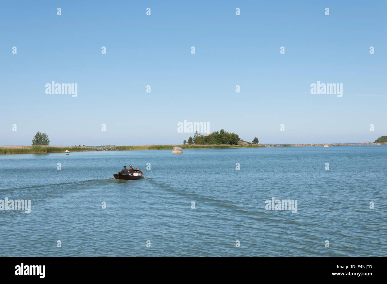 Two fishermen leaving the harbor at Kilin Stock Photo - Alamy