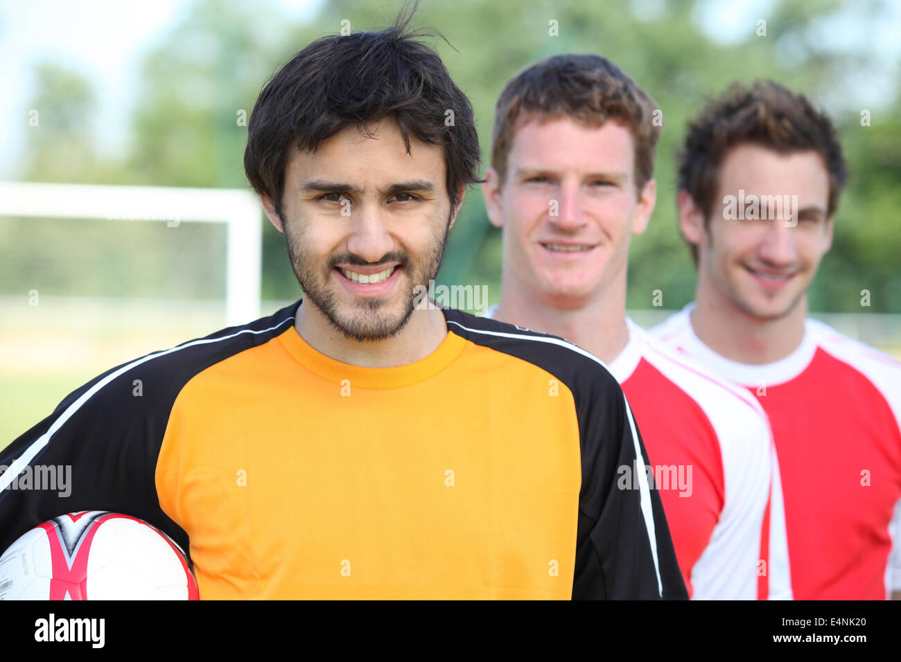 Three football players Stock Photo - Alamy