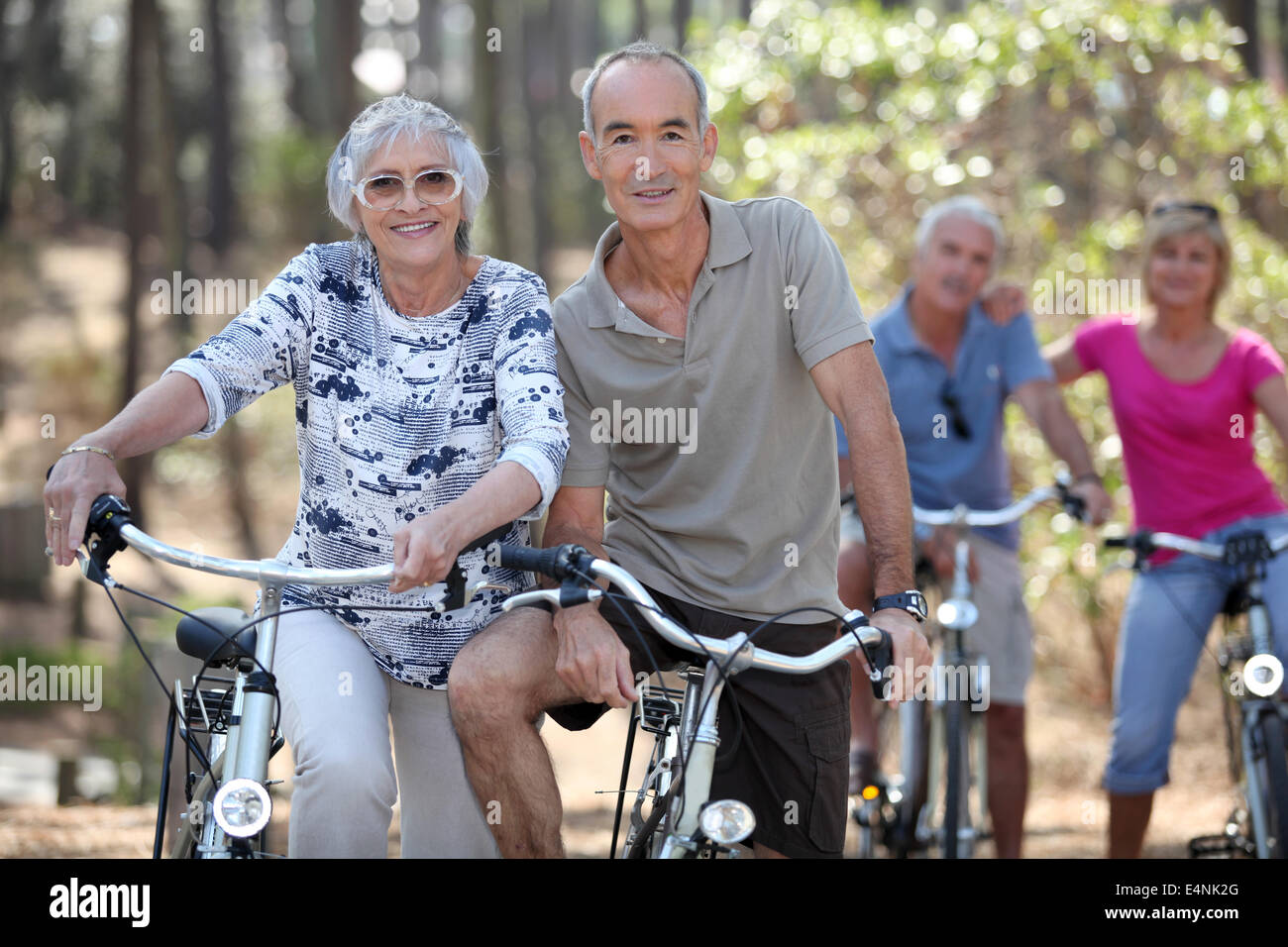 Mature couples on a double date biking Stock Photo - Alamy