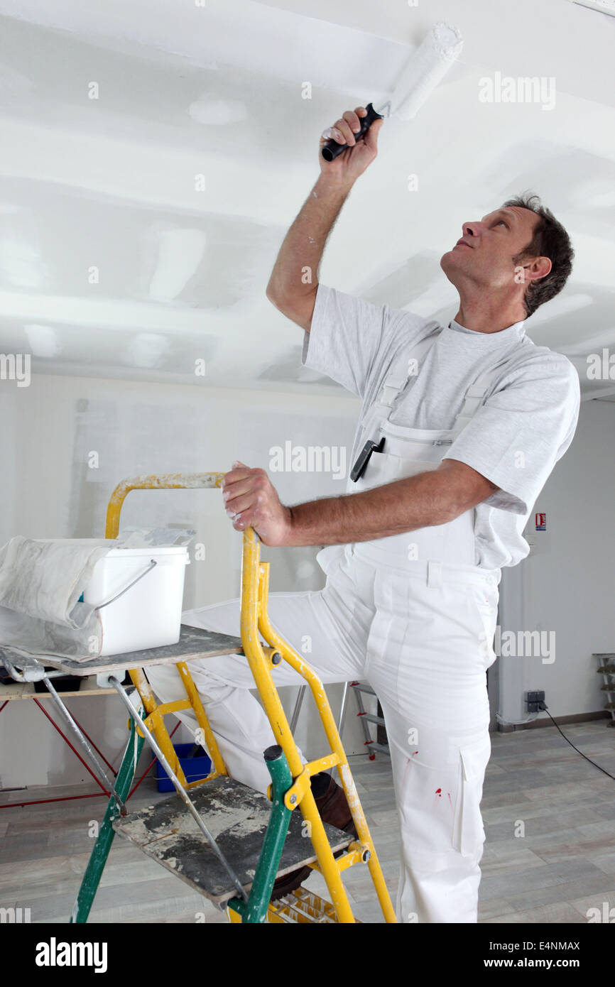 craftsman painting the ceiling Stock Photo - Alamy