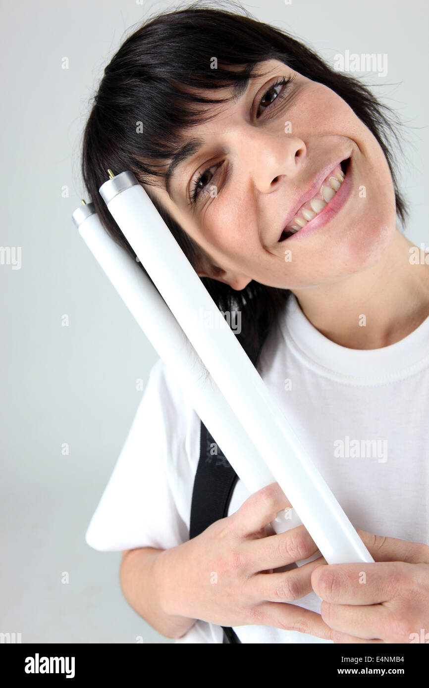 Woman holding tube bulb Stock Photo - Alamy