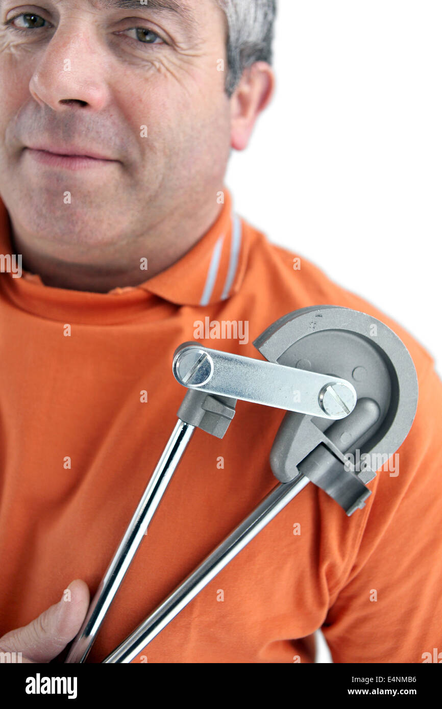 Man holding contraption in hand Stock Photo - Alamy