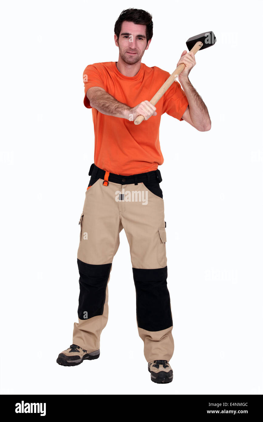 A man with a sledgehammer Stock Photo - Alamy