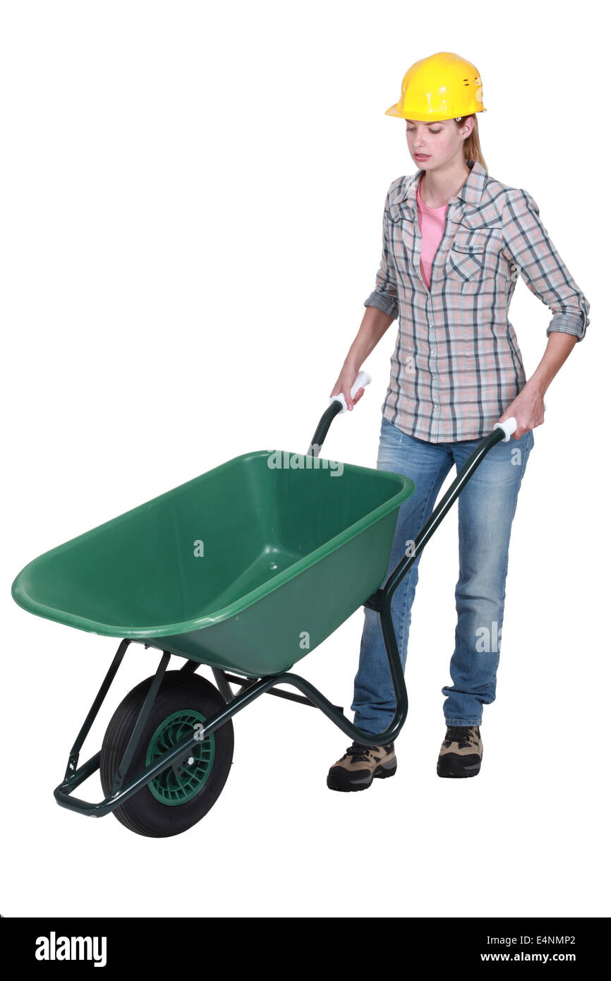 Female construction worker with a wheelbarrow Stock Photo - Alamy