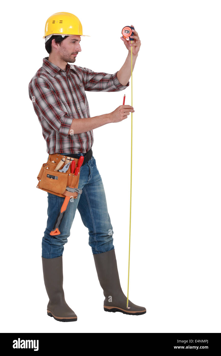 Man using tape measure Stock Photo - Alamy Man using tape measure Stock Photo - Alamy