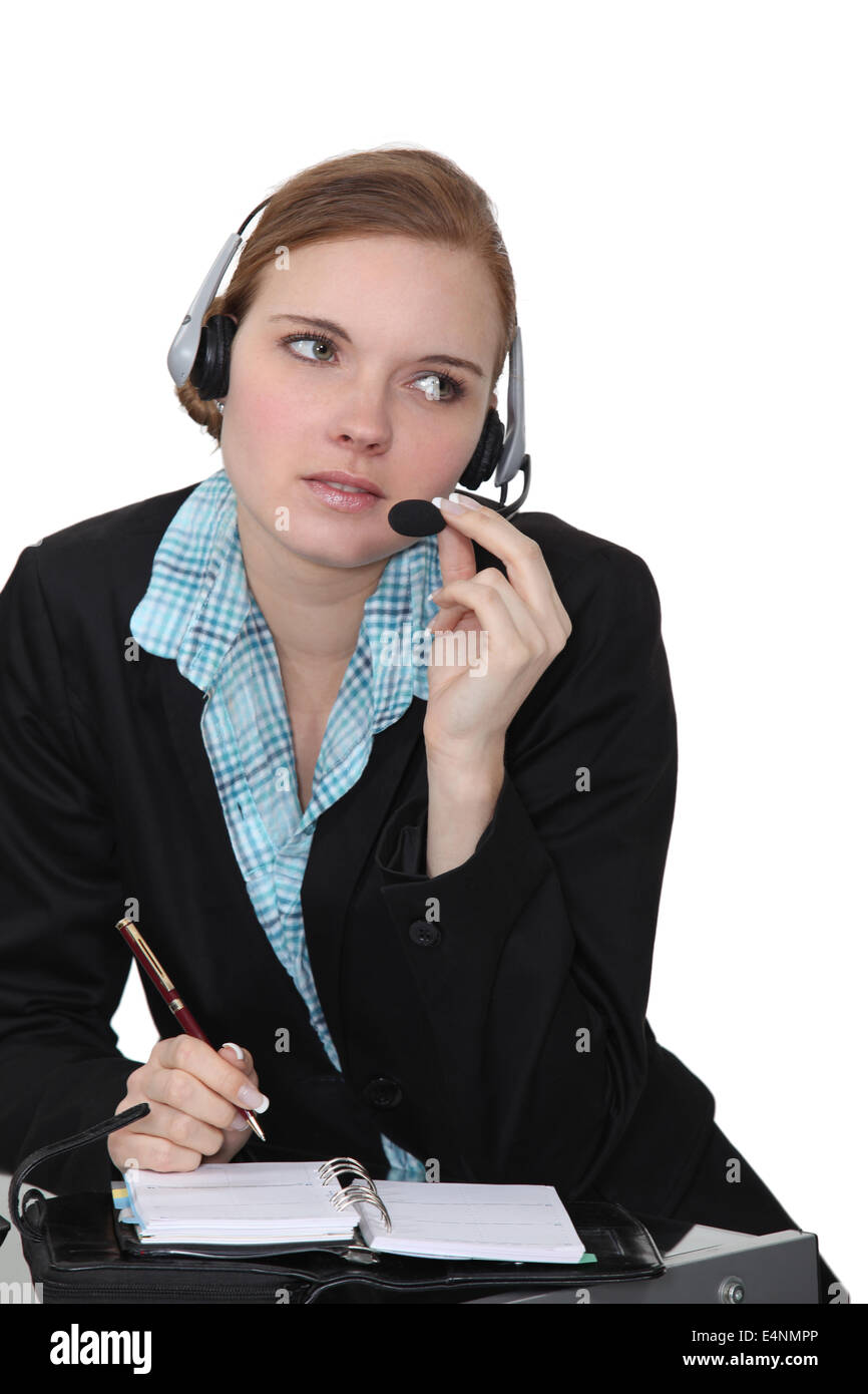 Secretary writing in agenda Stock Photo - Alamy
