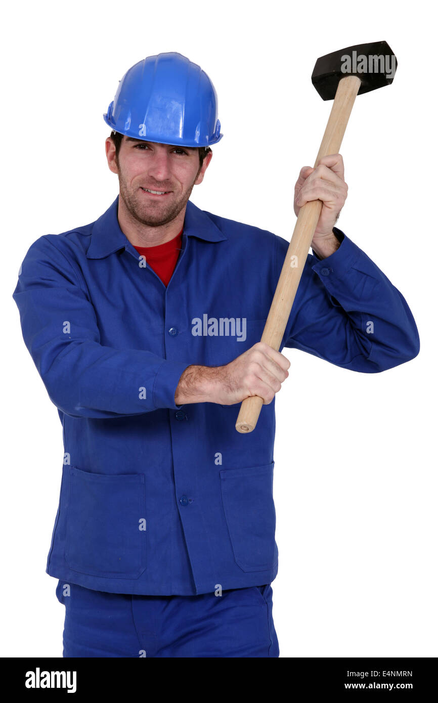 Construction worker holding a mallet Stock Photo - Alamy