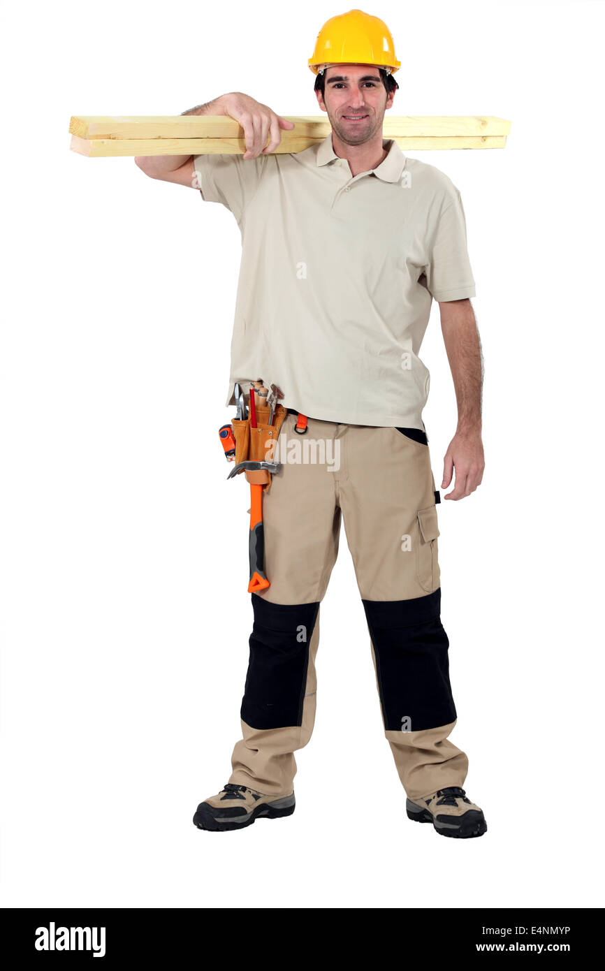 Man carrying wood planks Cut Out Stock Images & Pictures - Alamy