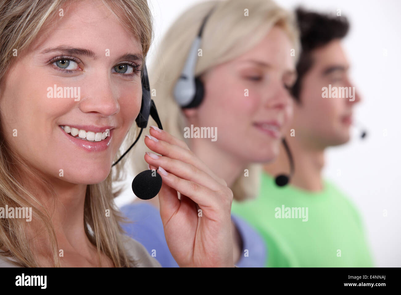 Team call centre agents talking hi-res stock photography and images - Alamy
