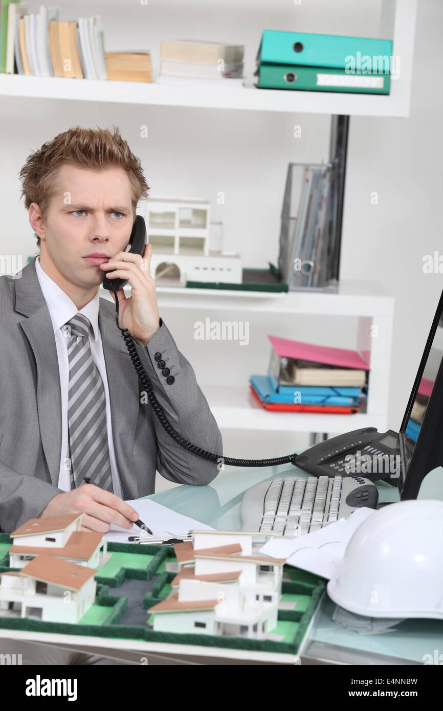 Architect taking a telephone call Stock Photo - Alamy