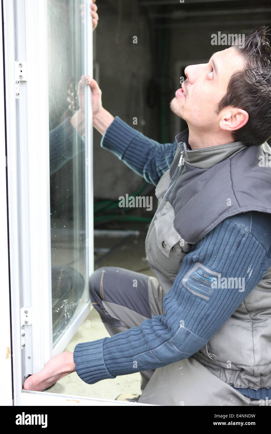 Window-fitter at work Stock Photo - Alamy