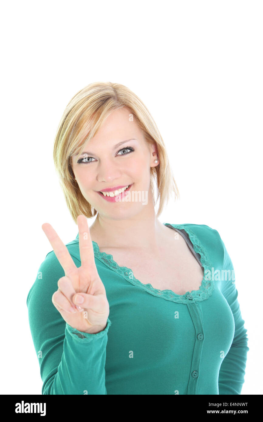 Beautiful woman giving a V-sign Stock Photo - Alamy