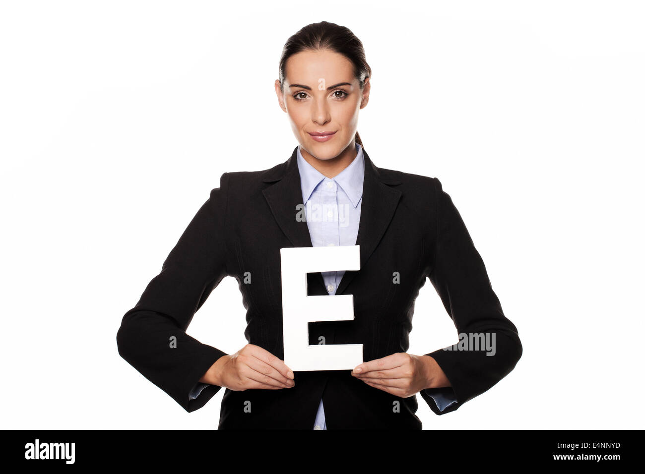 Businesswoman holding a capital letter E Stock Photo - Alamy