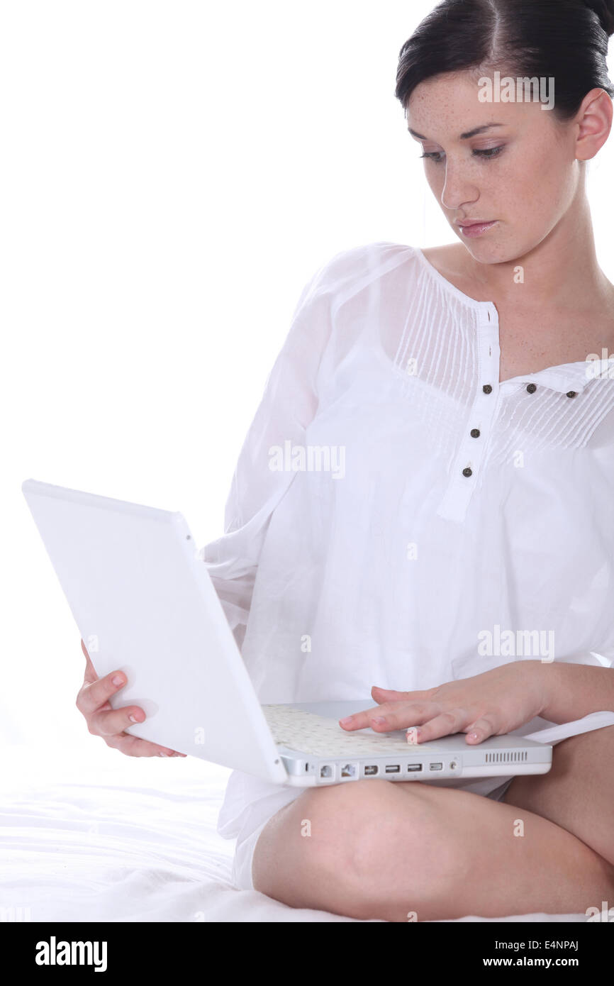 Brunette woman with computer Stock Photo - Alamy