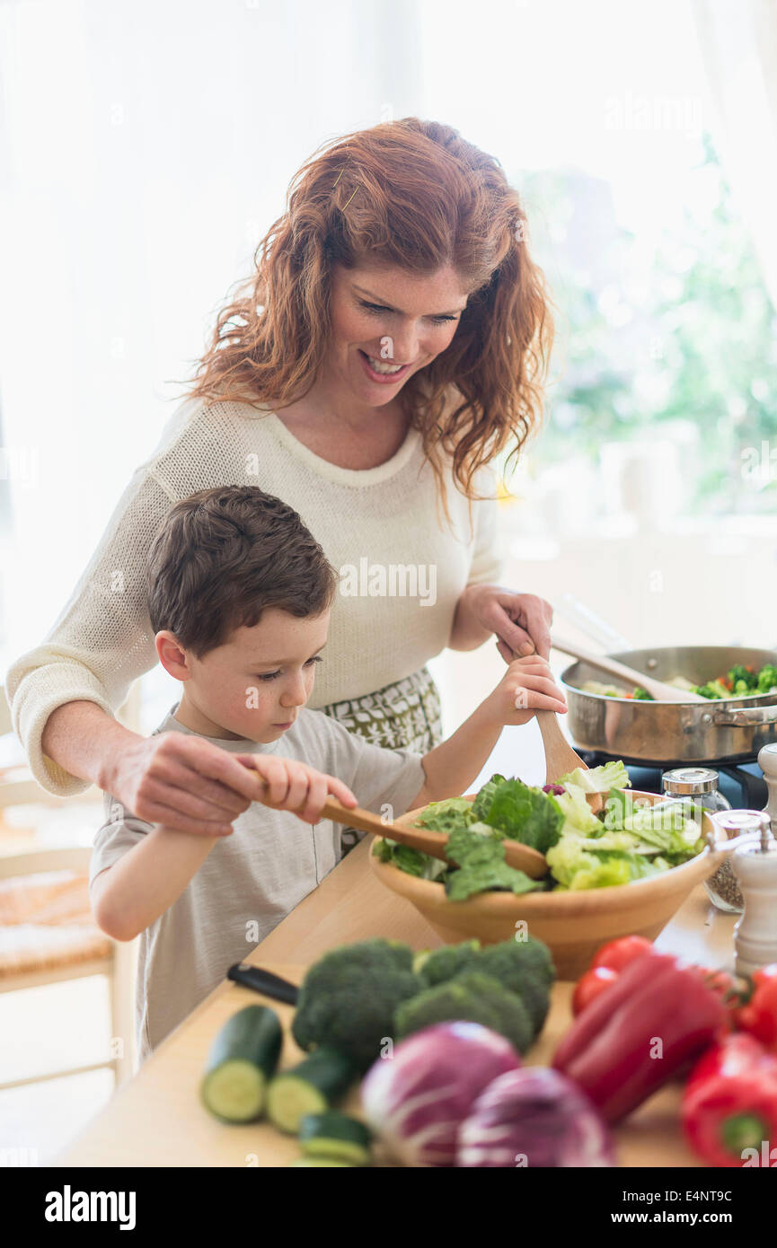 Mother son cooking food together hi-res stock photography and images ...