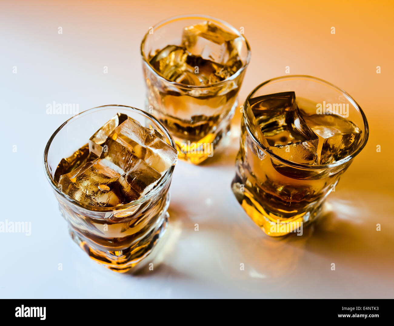 whisky with ice , focus on a foreground Stock Photo - Alamy