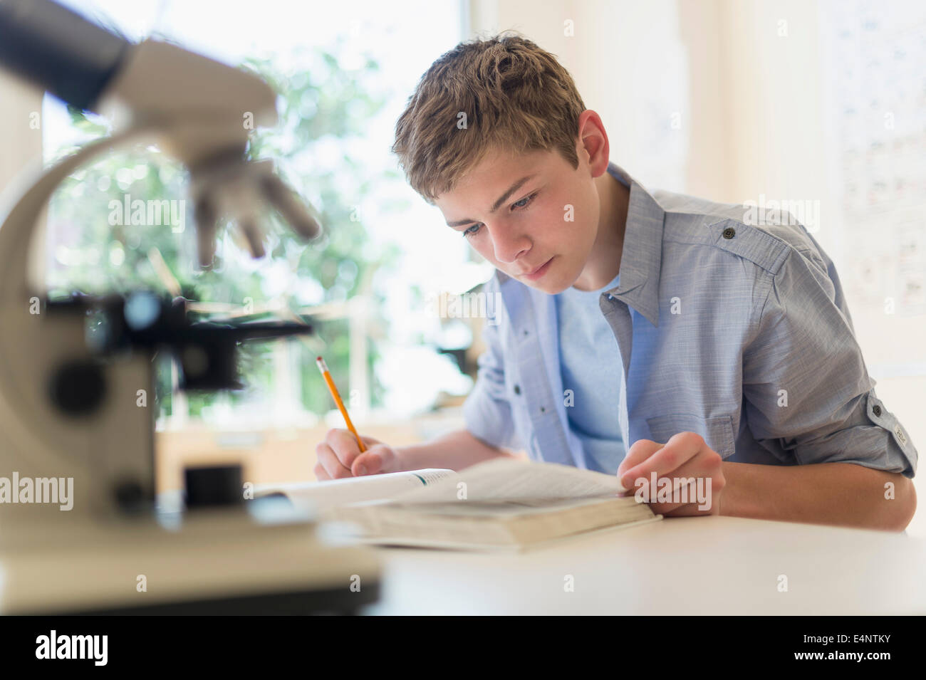 Teen reading book boy hi-res stock photography and images - Alamy