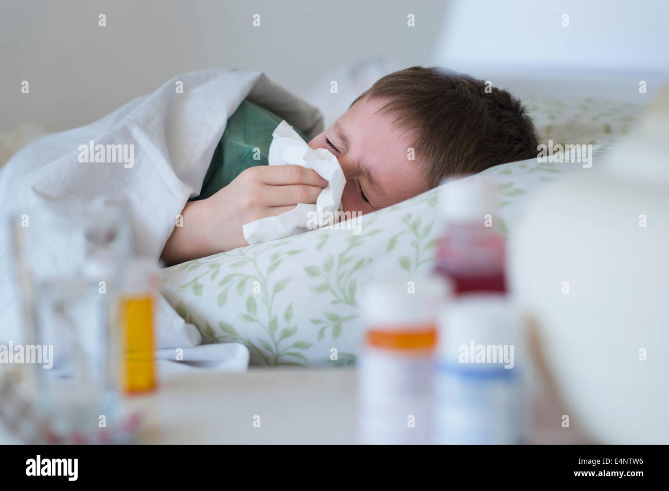 Kid blowing nose 8 9 years hi-res stock photography and images - Alamy